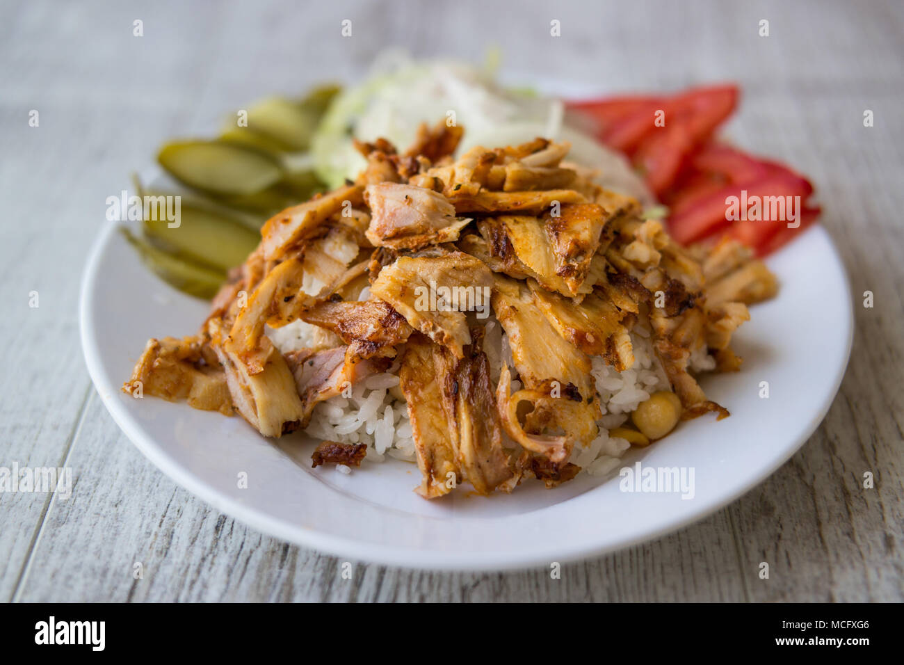 Turkish Chicken Doner Kebab with rice in a white plate Stock Photo - Alamy