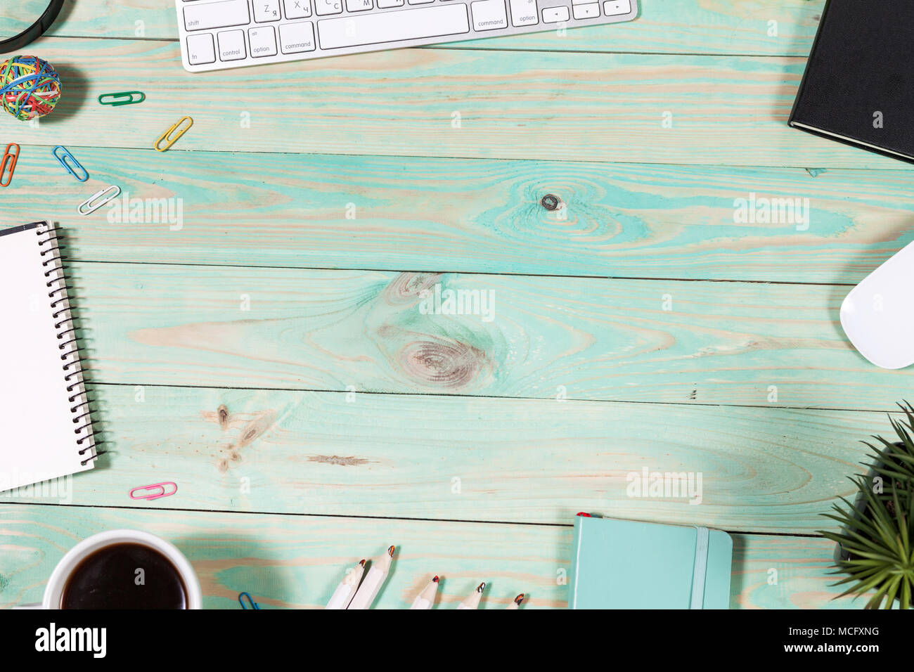 Blue office desk table with with office supplies. Top view with copy ...
