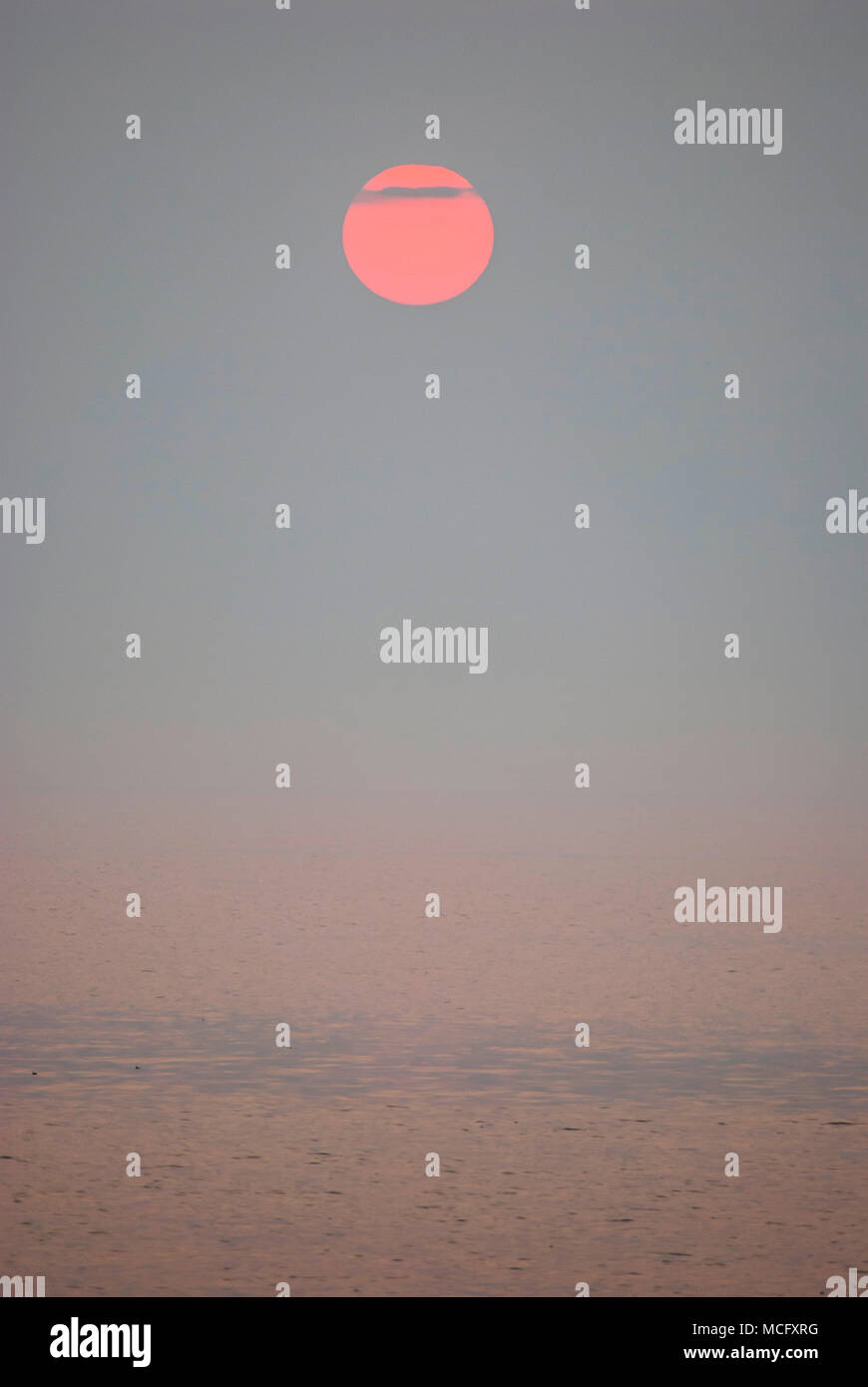 Sun rising over Lake Ontario Stock Photo - Alamy