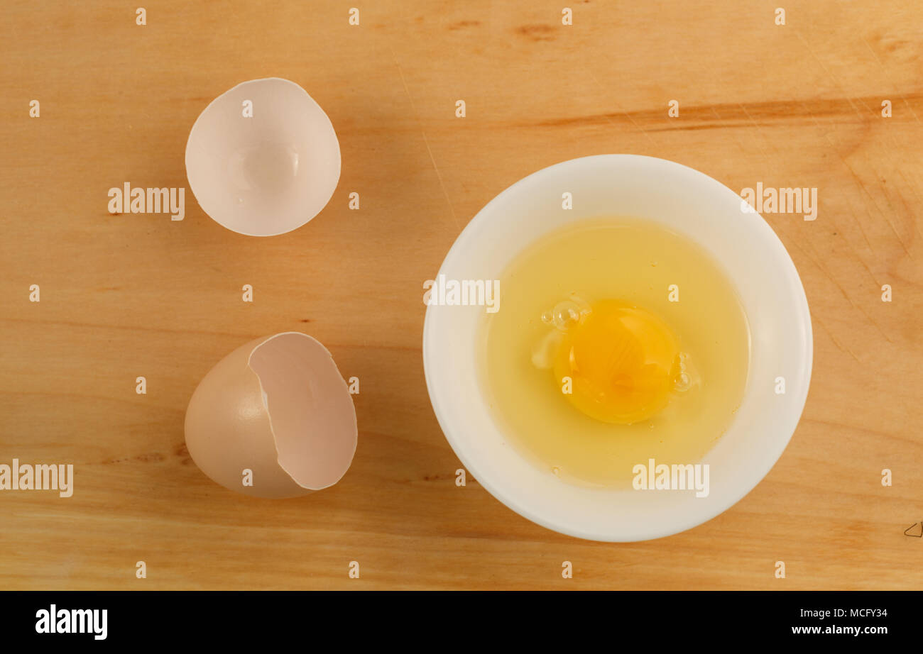 The close up of an open fresh egg Stock Photo - Alamy