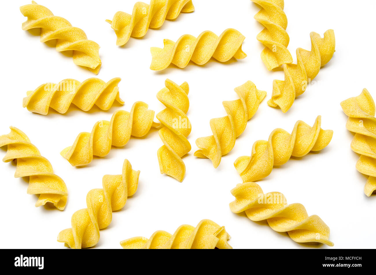 some separate spiral pasta on white background Stock Photo - Alamy