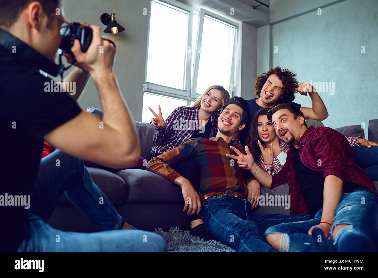 A group of friends are photographed on a camera indoors Stock Photo - Alamy