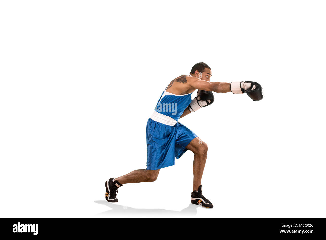 Sporty man during boxing exercise. Photo of boxer on white background ...