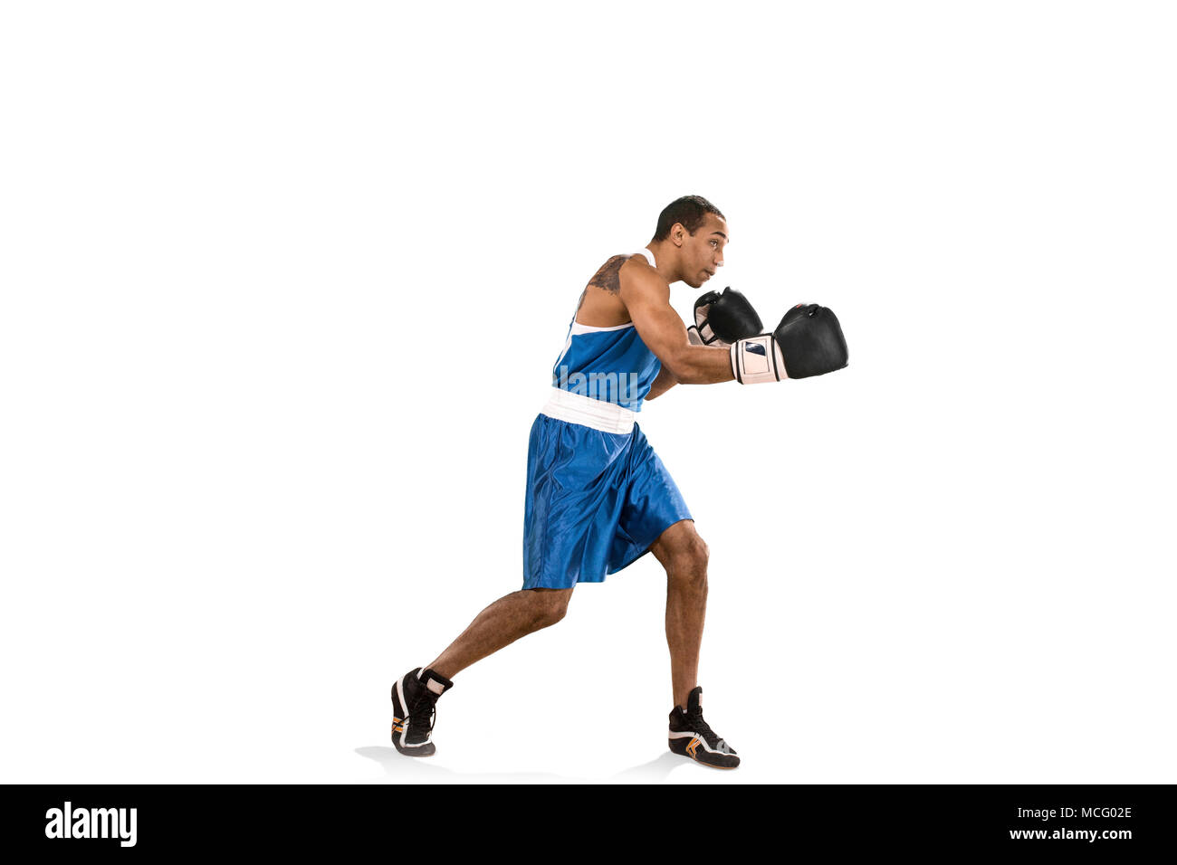 Sporty man during boxing exercise. Photo of boxer on white background ...