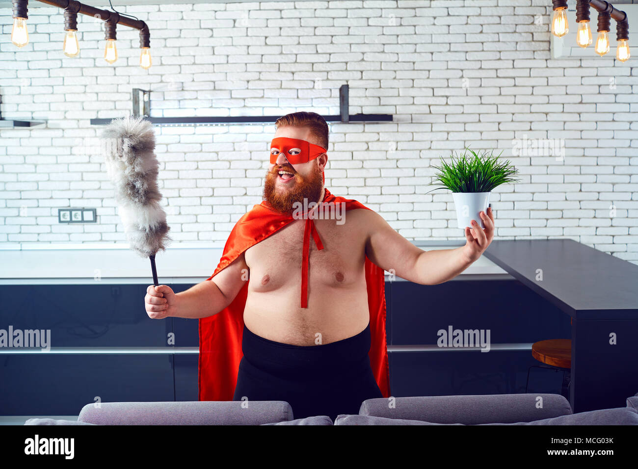 A fat, funny man in a superhero costume is cleaning the house. Cleaner ...