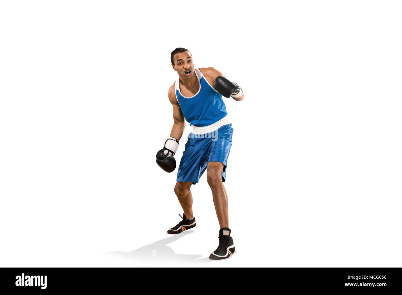 Sporty man during boxing exercise. Photo of boxer on white background ...