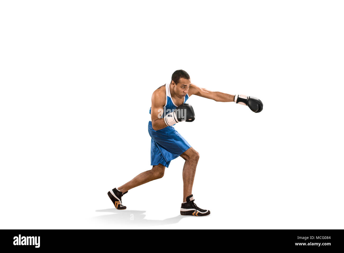 Sporty man during boxing exercise. Photo of boxer on white background ...