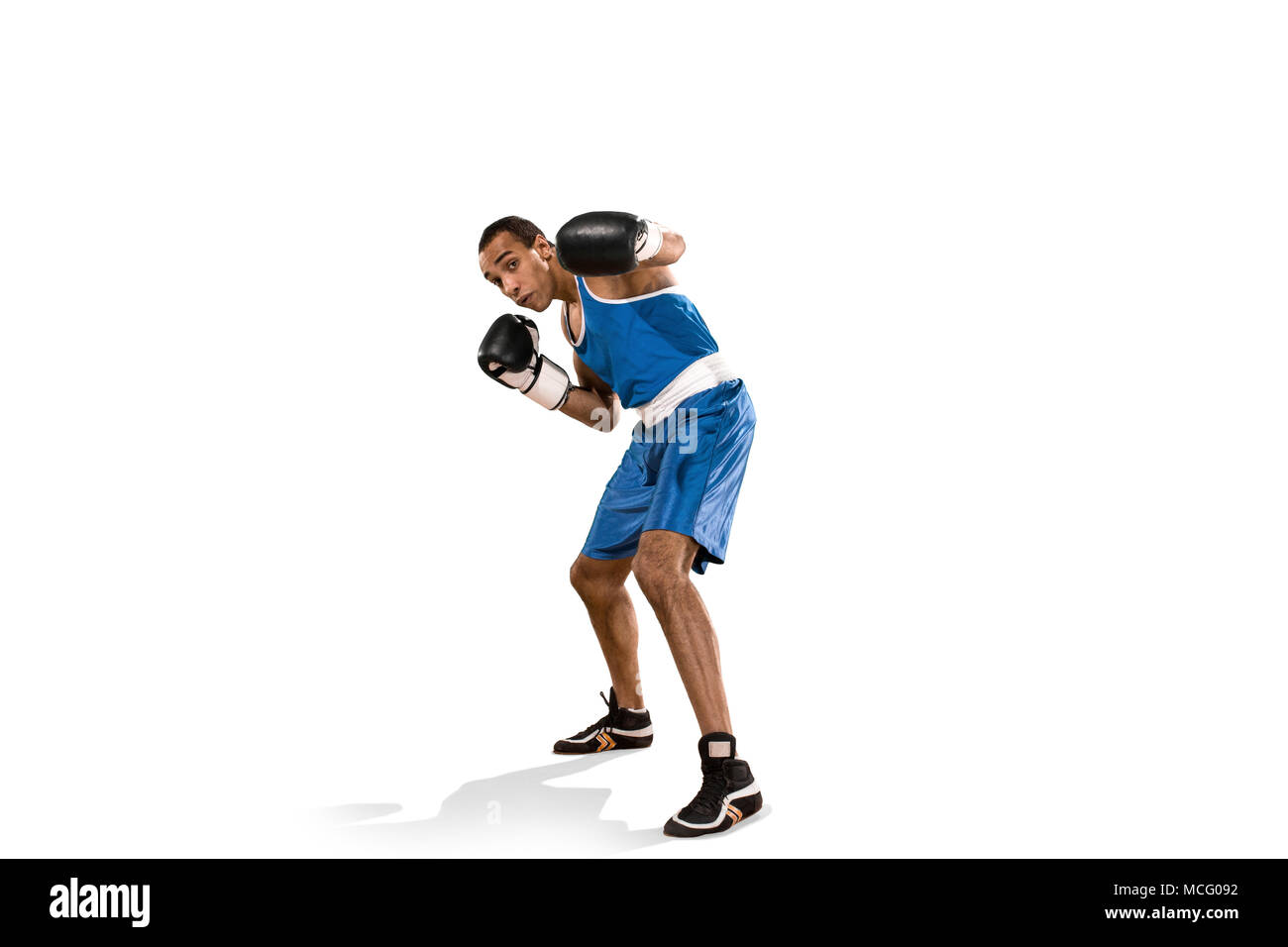 Sporty man during boxing exercise. Photo of boxer on white background ...
