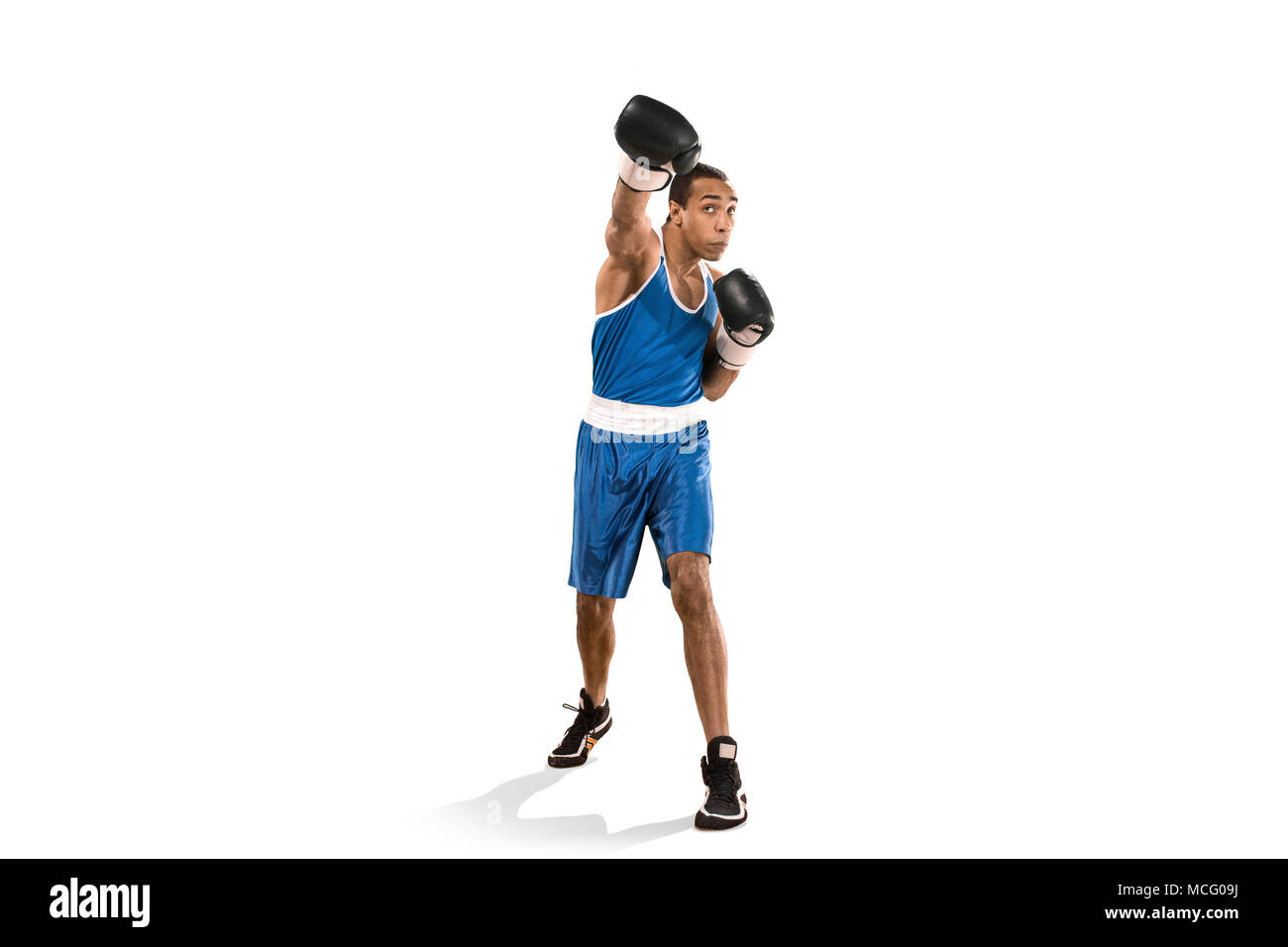 Sporty man during boxing exercise. Photo of boxer on white background ...