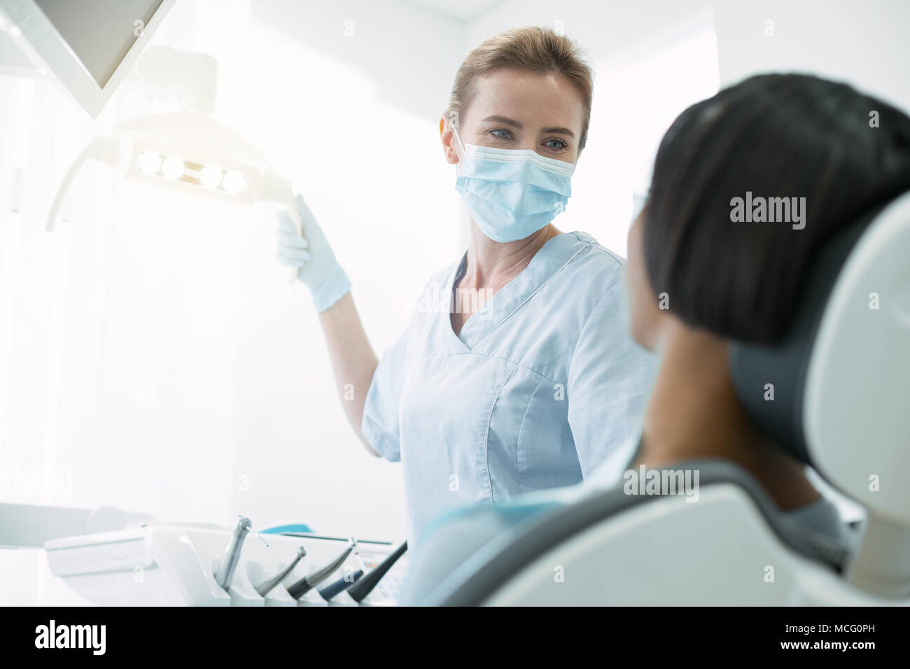 Happy dentist doing dental work Stock Photo - Alamy
