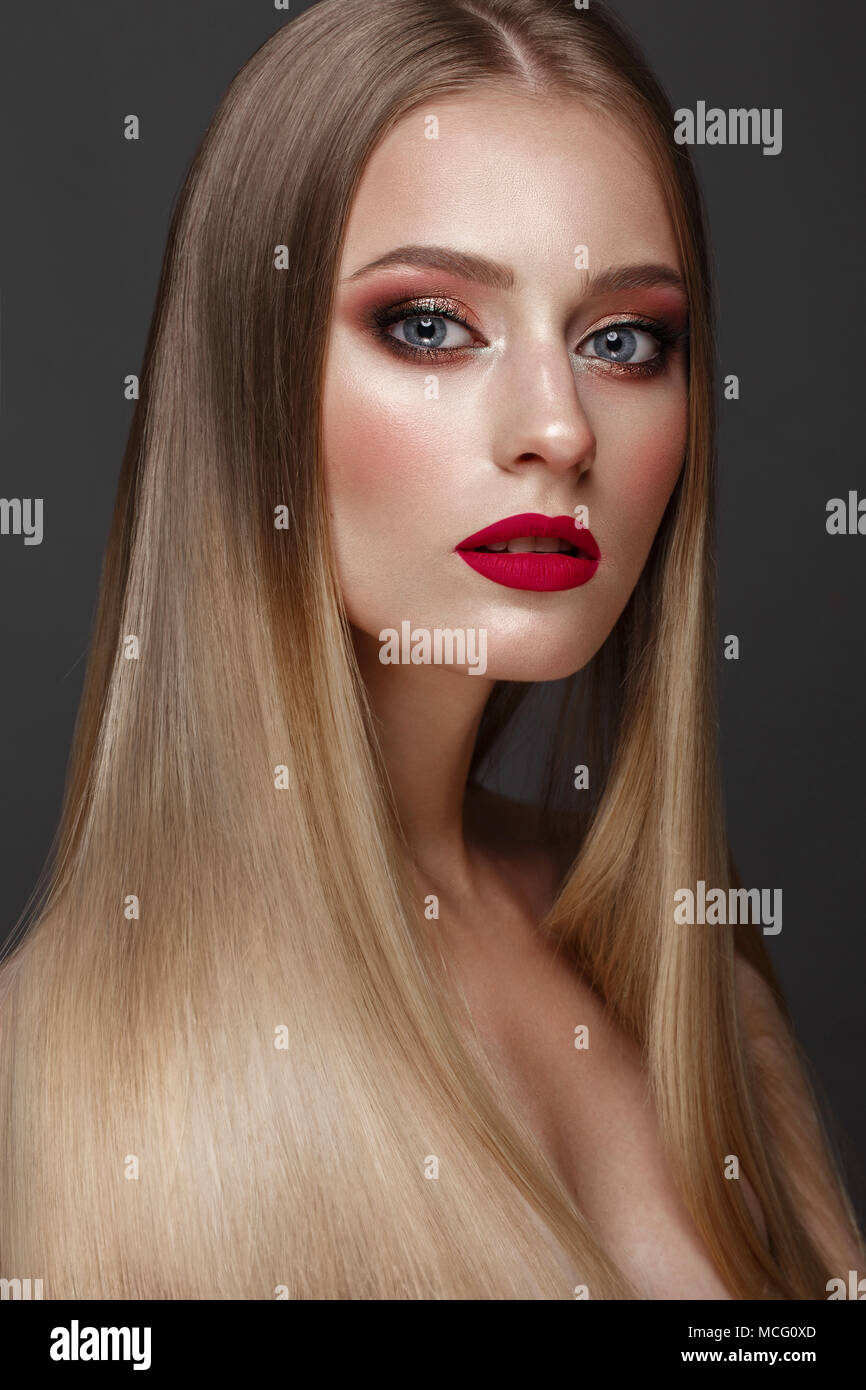Beautiful Blond Girl With A Perfectly Smooth Hair Classic Make Up And