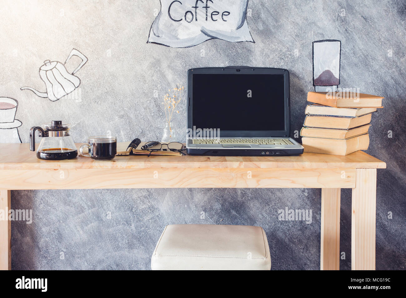 Working table bar with coffee , notebook , pen , glasses , laptop ...