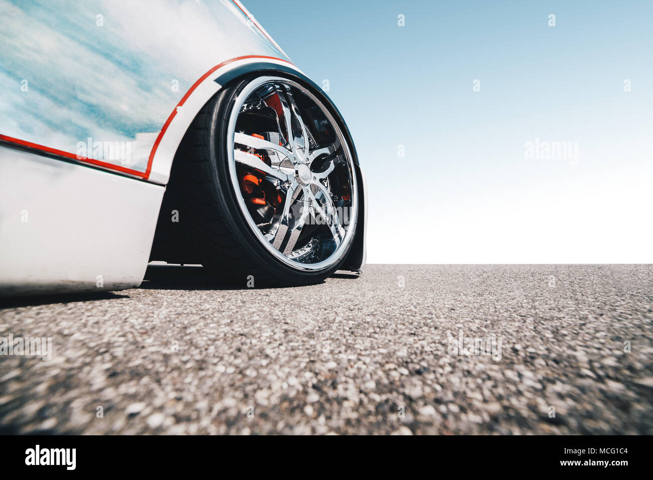 wide angle view of a modern custom fast car with decorated wheel ...