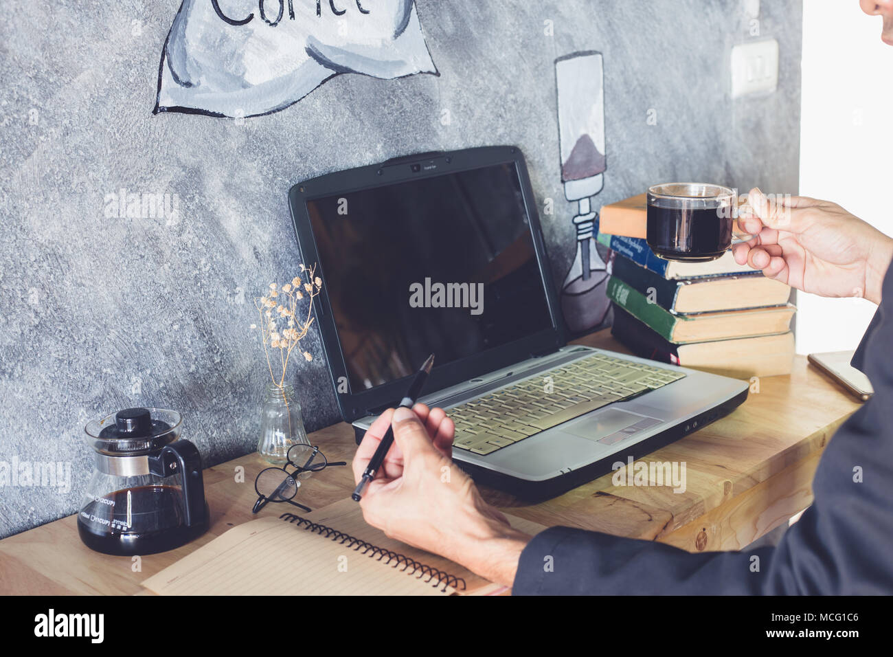 Businessman hands with press notebook on coffee shop table Stock Photo ...
