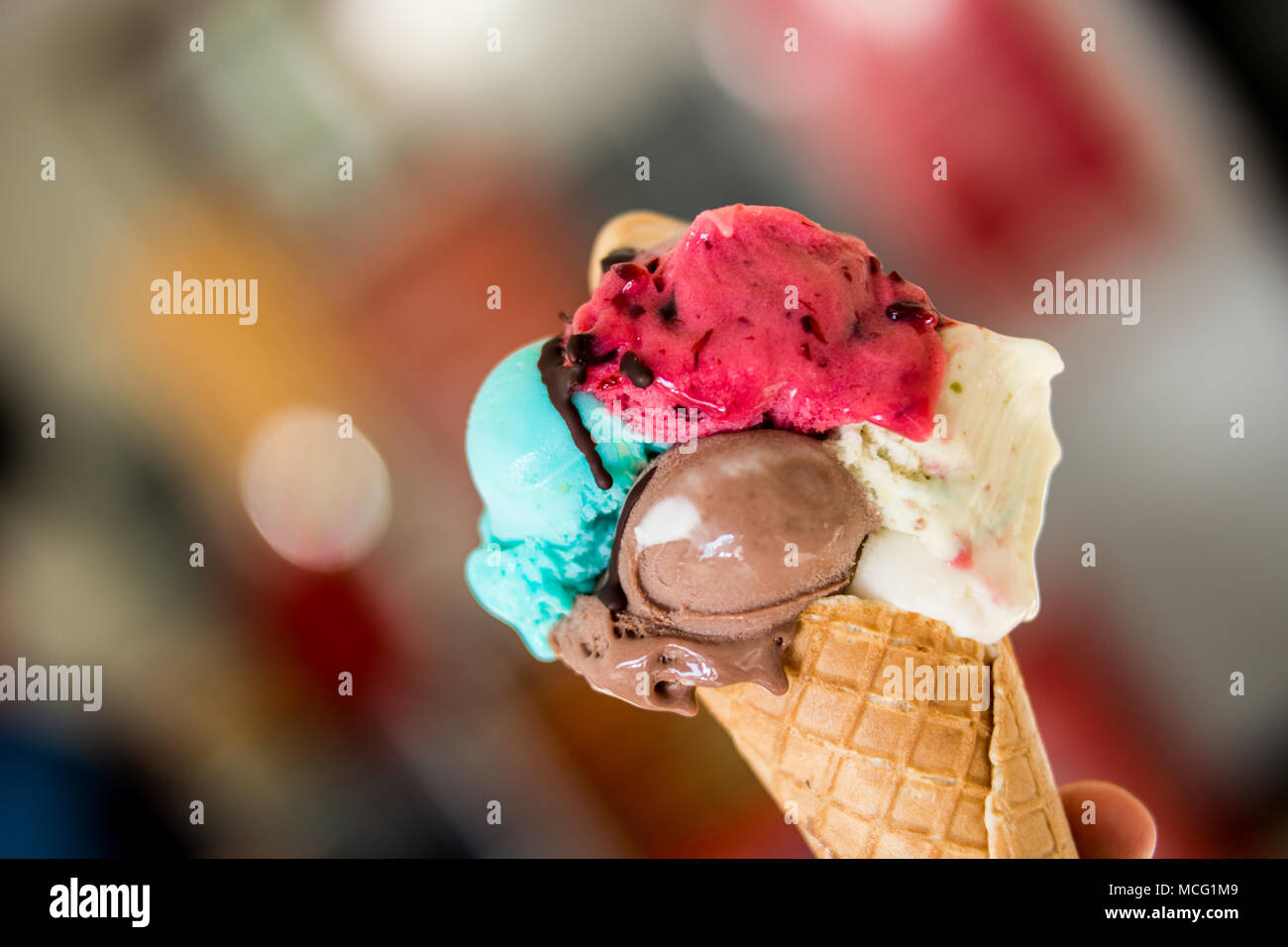 ice cream in cone holding by man Stock Photo - Alamy