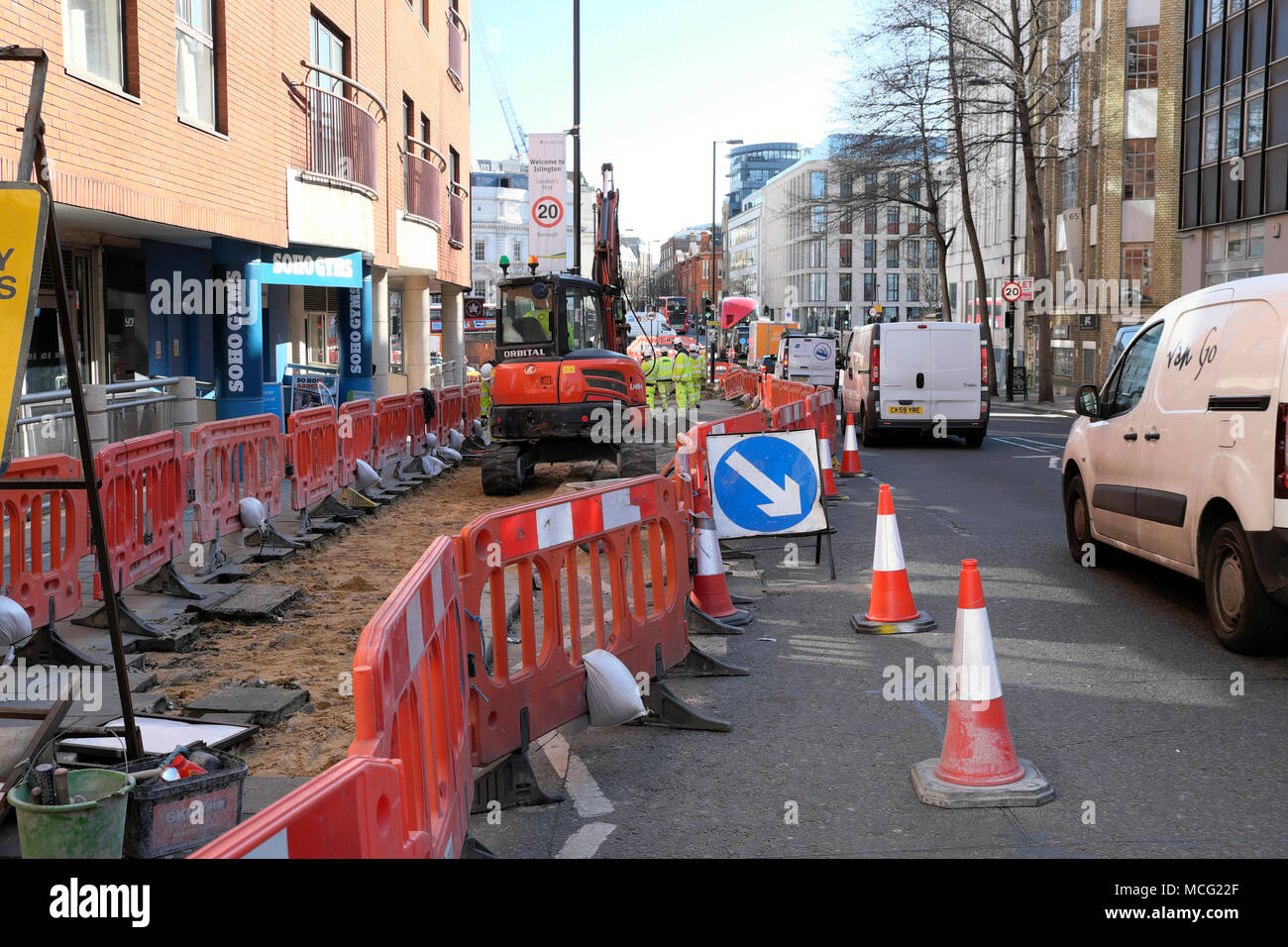 Cycle superhighway construction works sign and workers working on ...