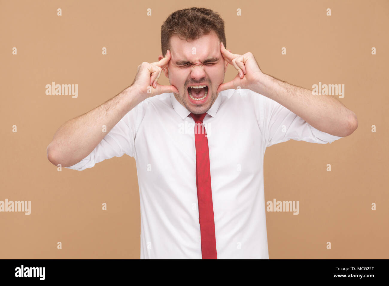 Angry businessman have migraine and headache. Business people concept ...