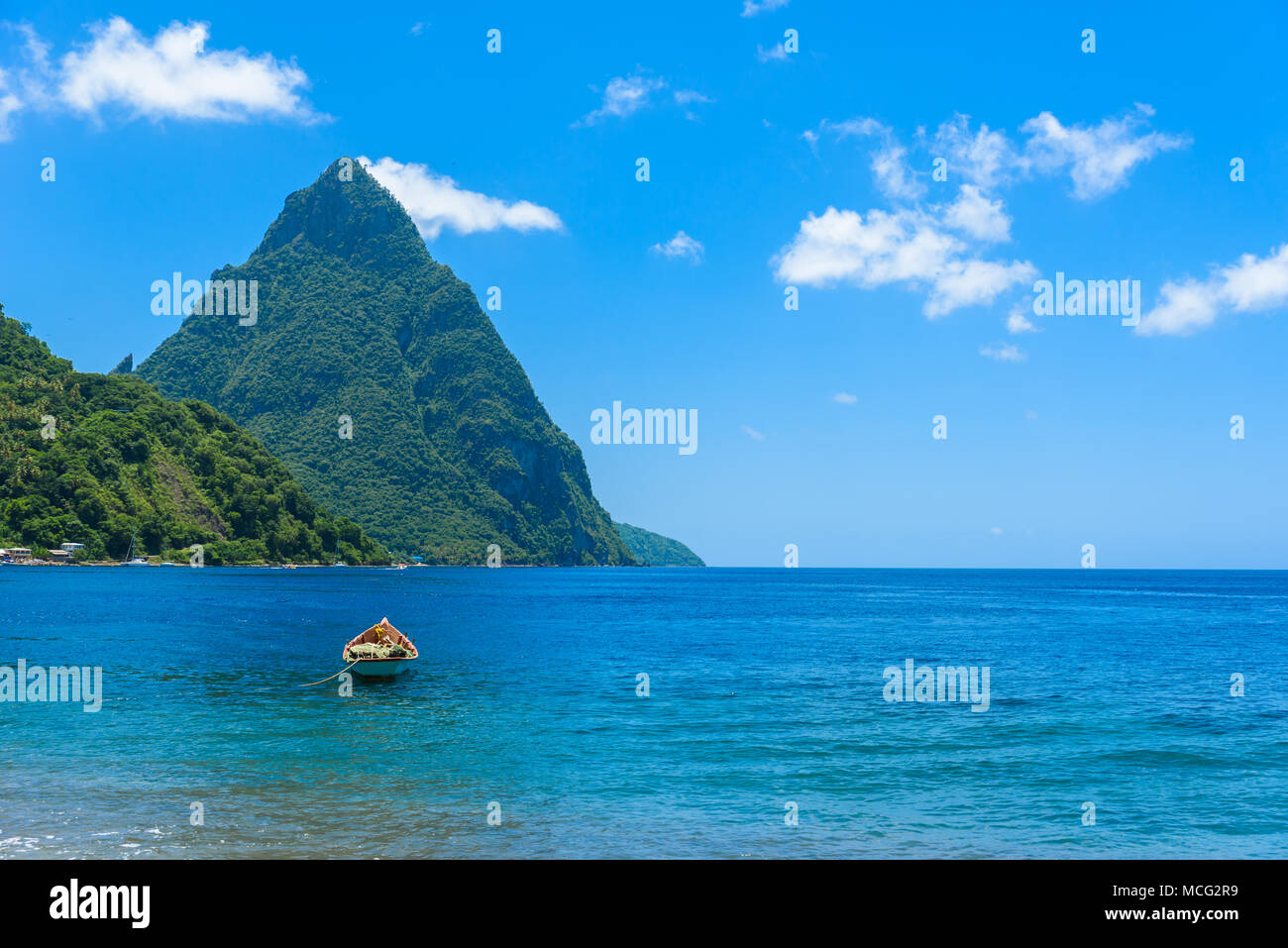 Paradise beach at Soufriere Bay with view to Piton at small town ...