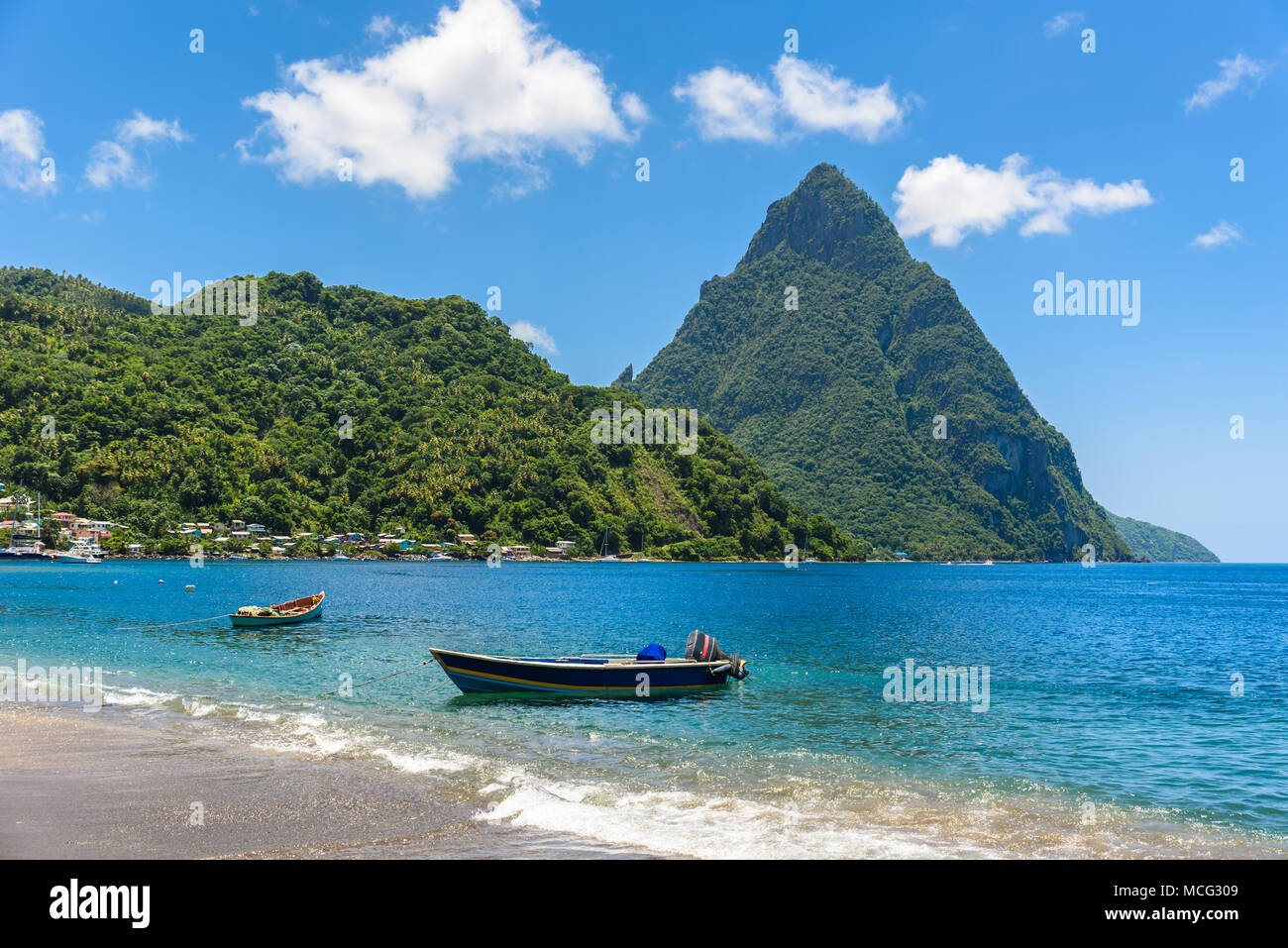 Paradise beach at Soufriere Bay with view to Piton at small town ...