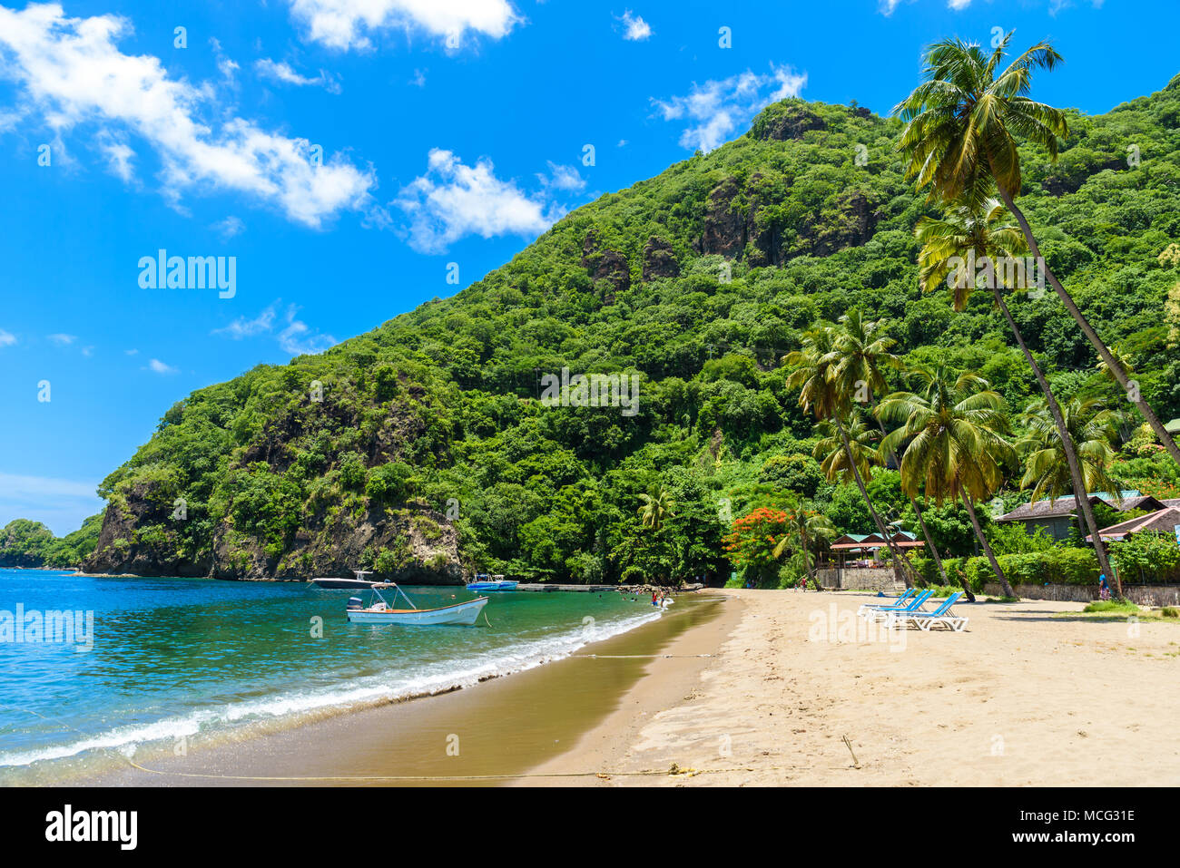 Paradise beach at Soufriere Bay with view to Piton at small town ...