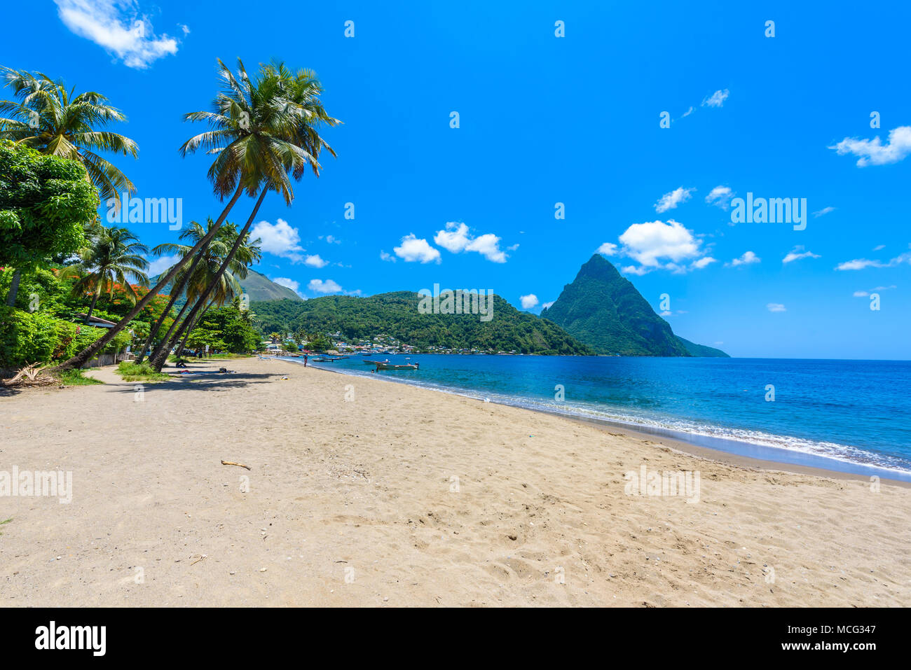 Paradise beach at Soufriere Bay with view to Piton at small town ...