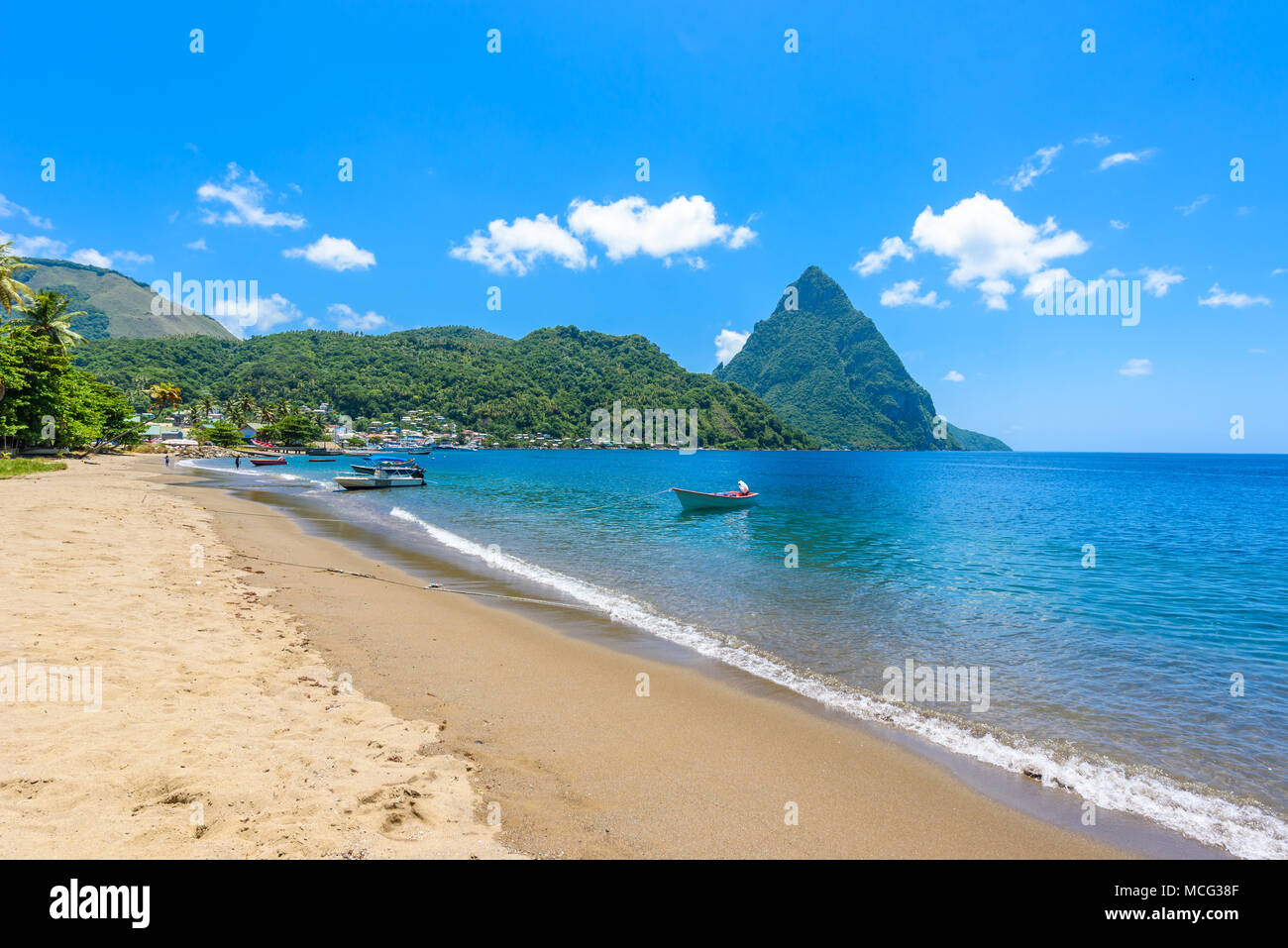 Paradise beach at Soufriere Bay with view to Piton at small town ...