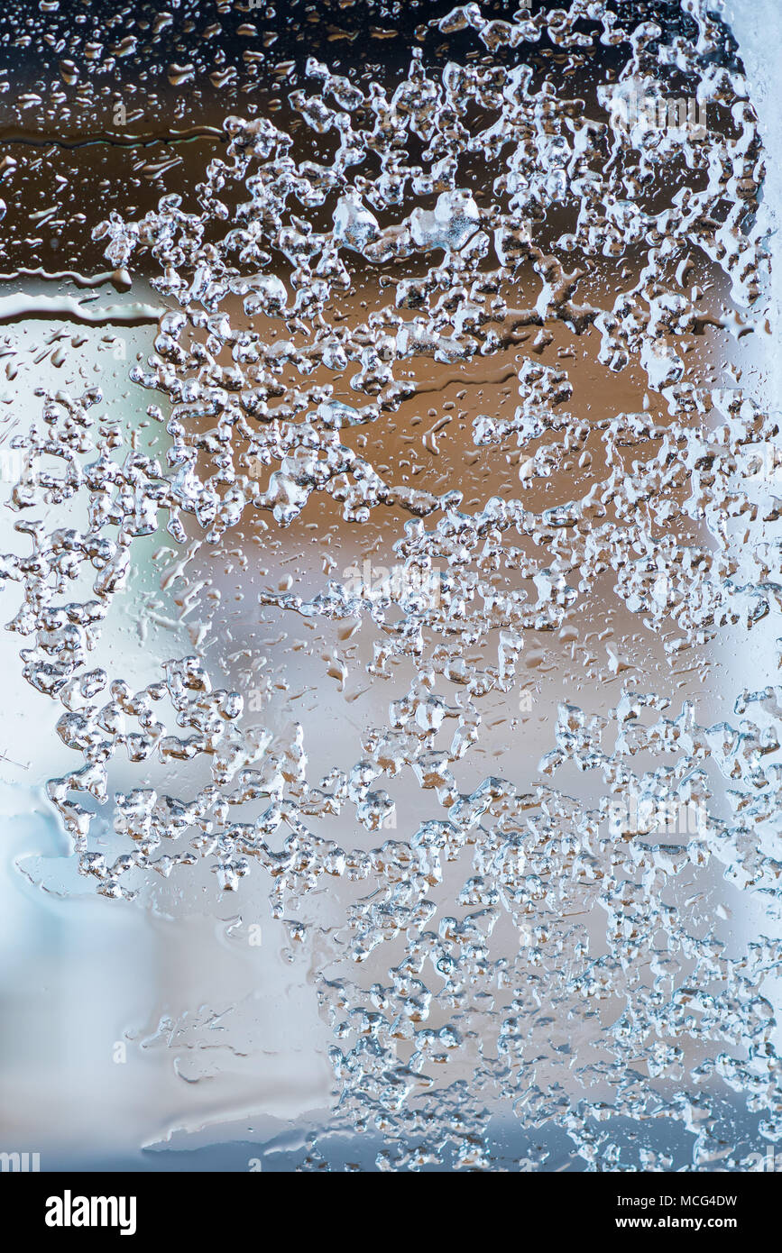 Melting frost on a glass window pane Stock Photo - Alamy