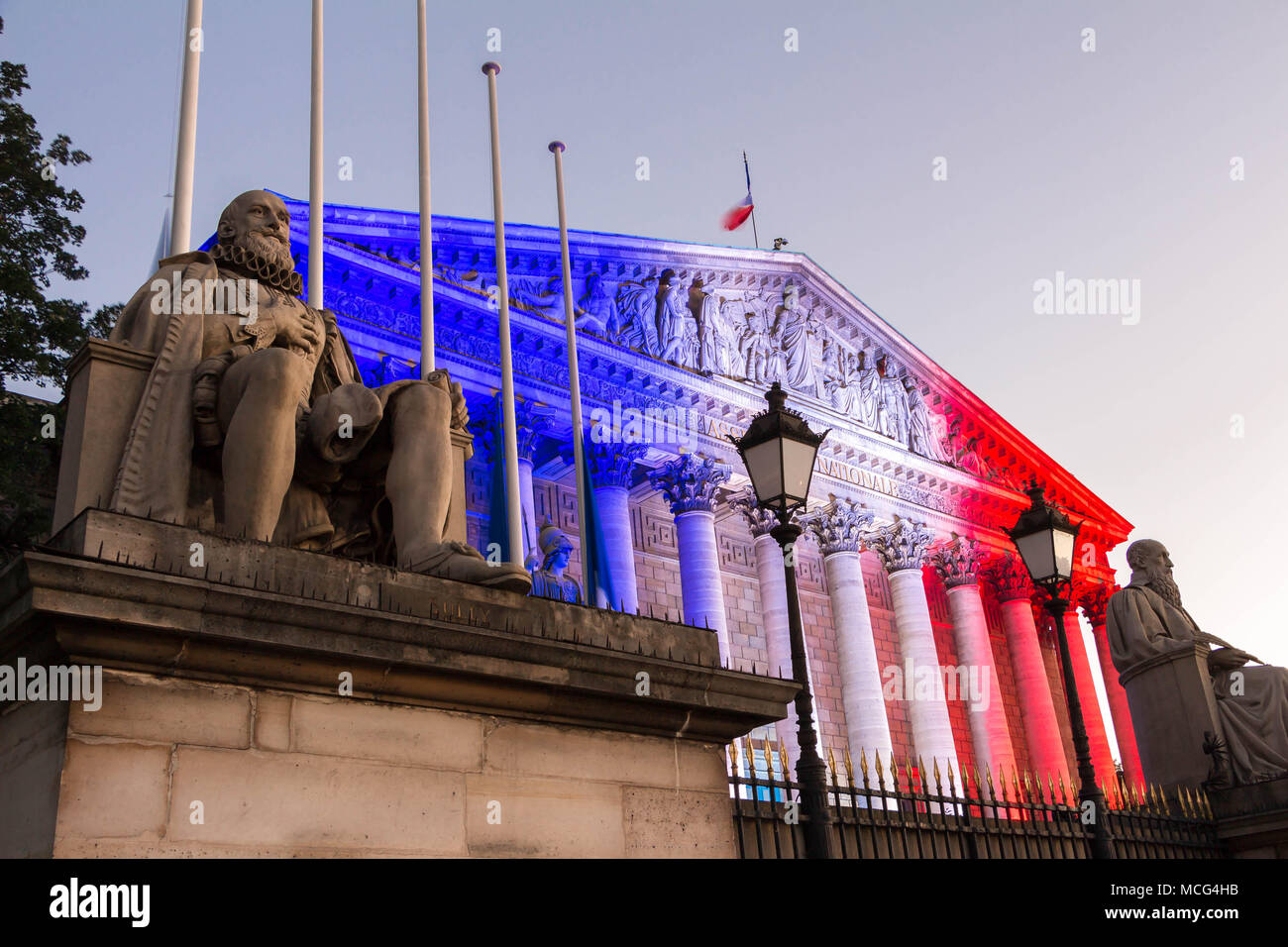 The French National Assembly lit up with colors of French national flag ...