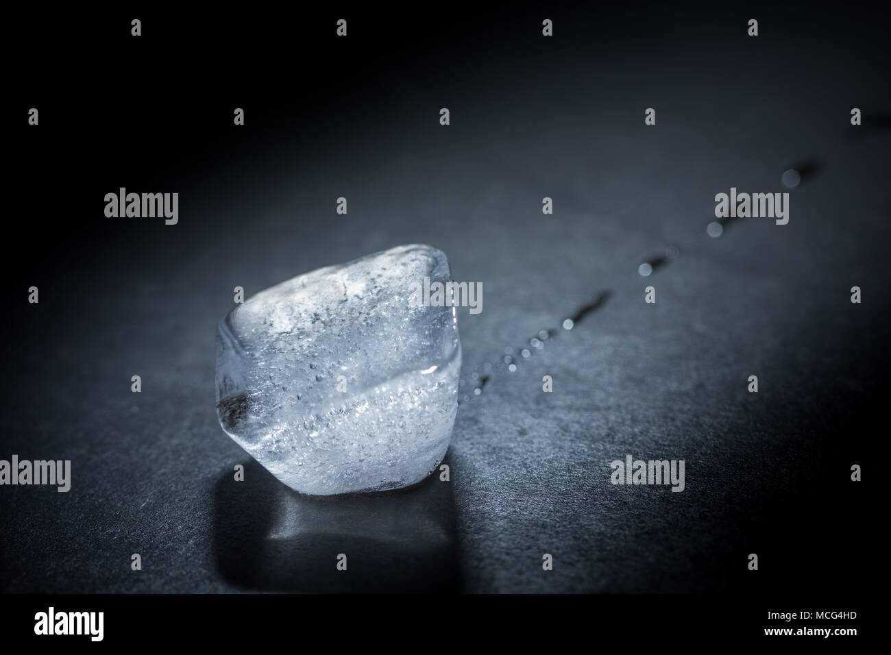real Ice cube close-up melting Stock Photo - Alamy