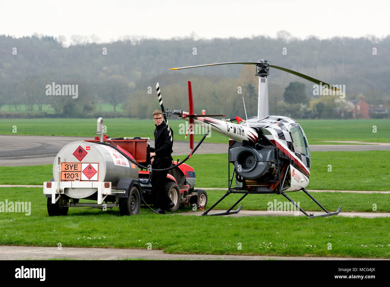 Robinson R22 Beta helicopter being refuelled at Wellesbourne Airfield ...