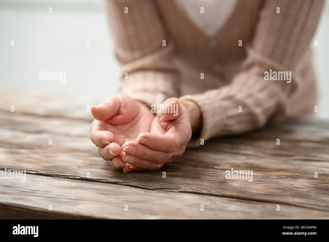 Close up of female hands being held together Stock Photo - Alamy