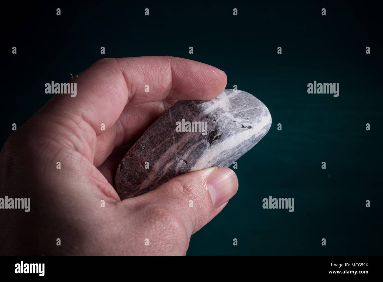 Pebble in left hand hi-res stock photography and images - Alamy