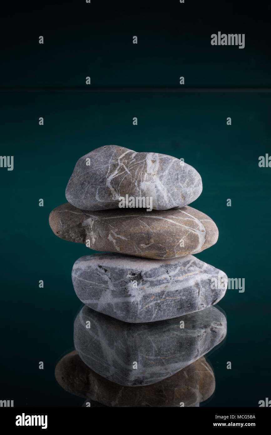 three emotional pebble stones stacked on top of each other Stock Photo ...