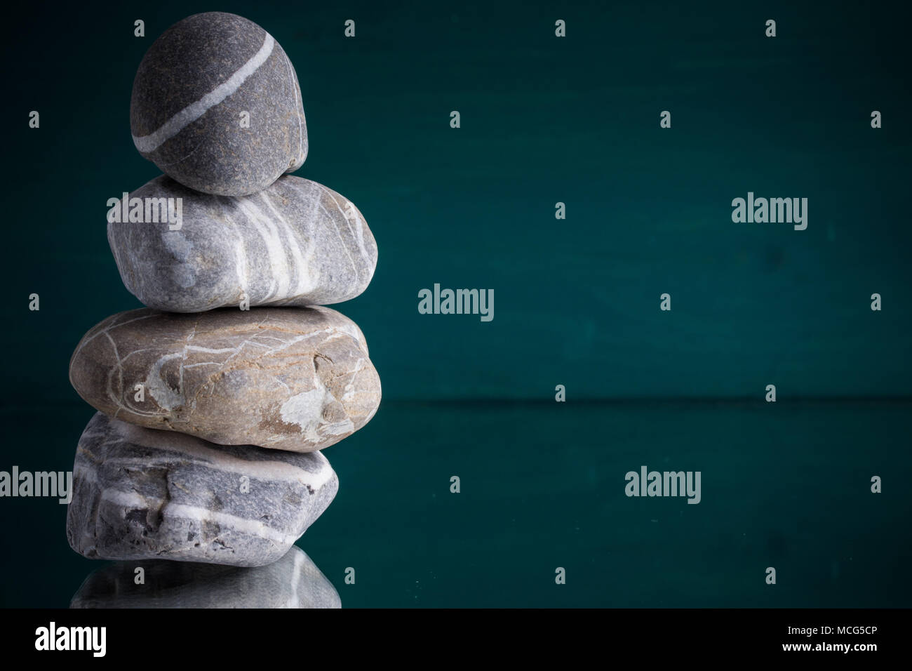 Tower of pebble stones - focus on the target Stock Photo - Alamy