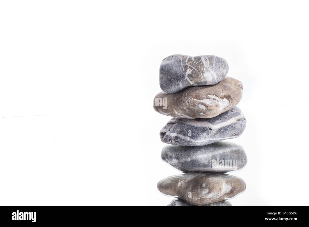 Stacked stones isolated on white Stock Photo - Alamy