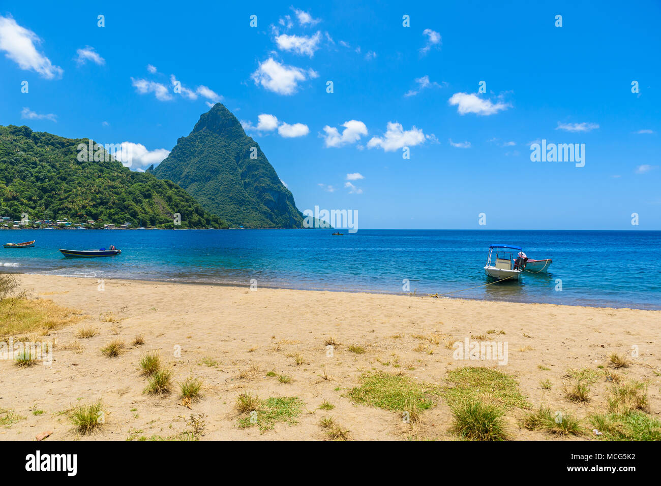 Paradise beach at Soufriere Bay with view to Piton at small town ...