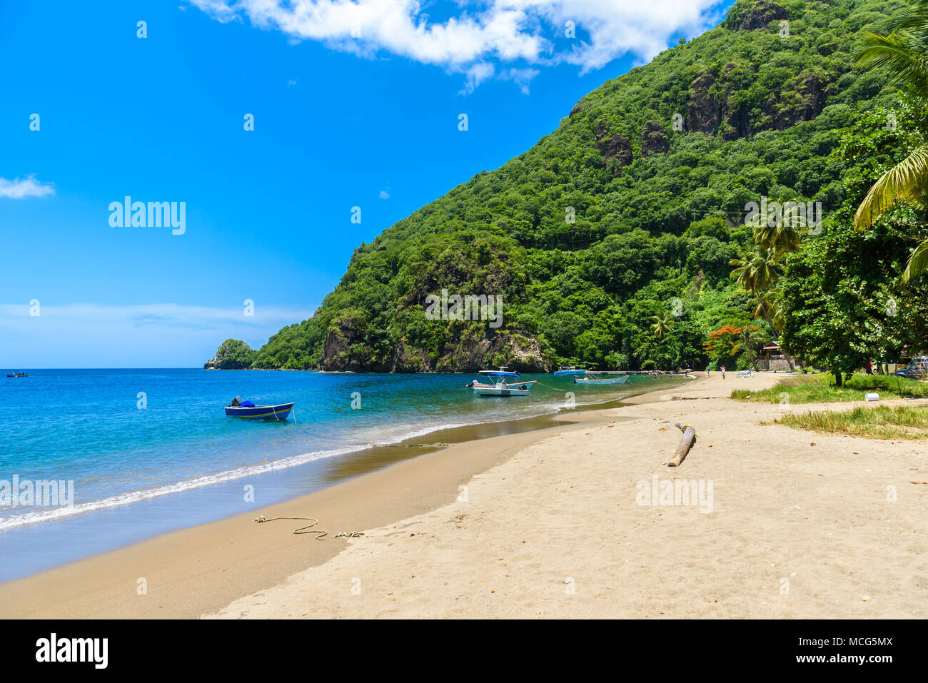 Paradise beach at Soufriere Bay with view to Piton at small town ...
