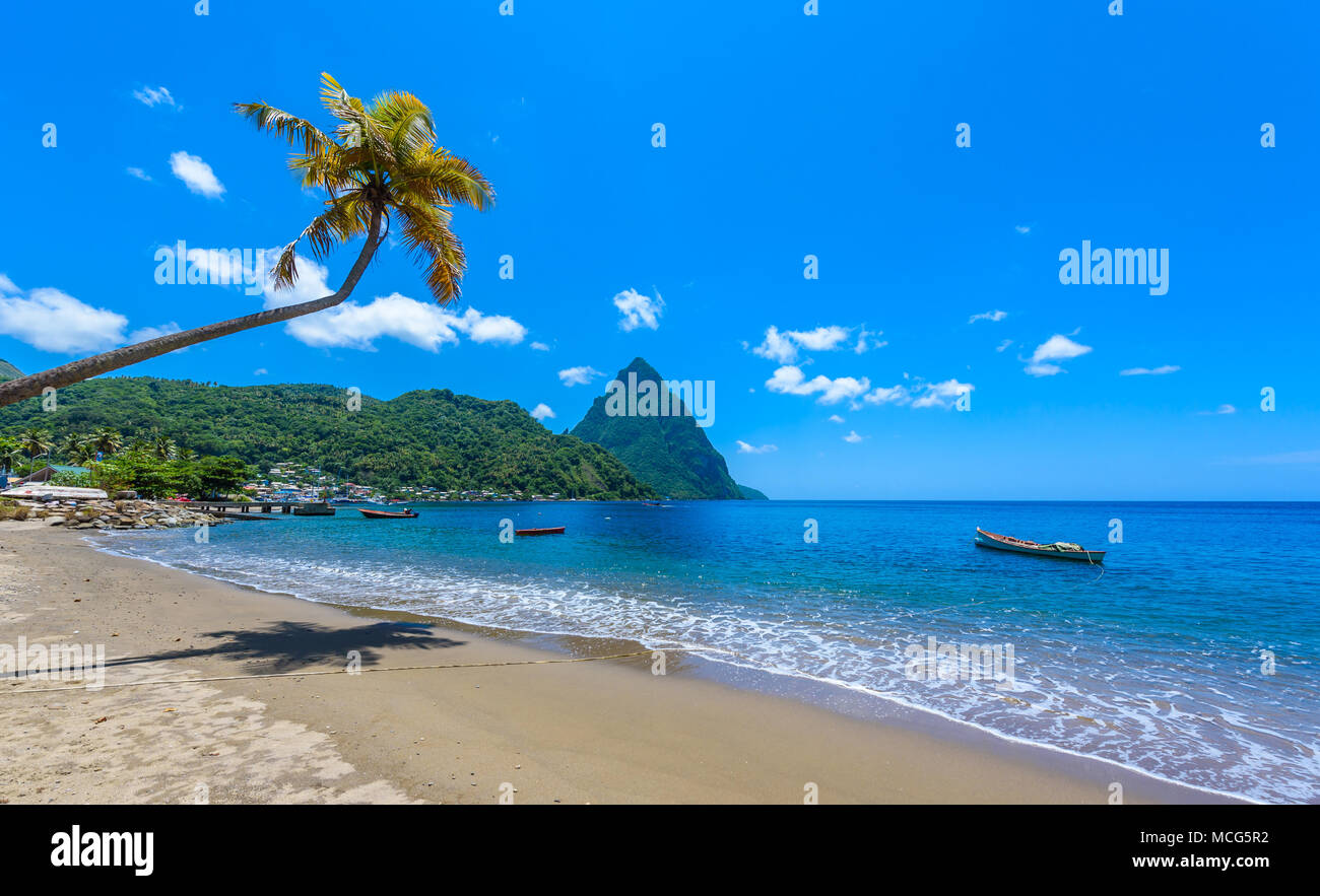 Paradise beach at Soufriere Bay with view to Piton at small town ...