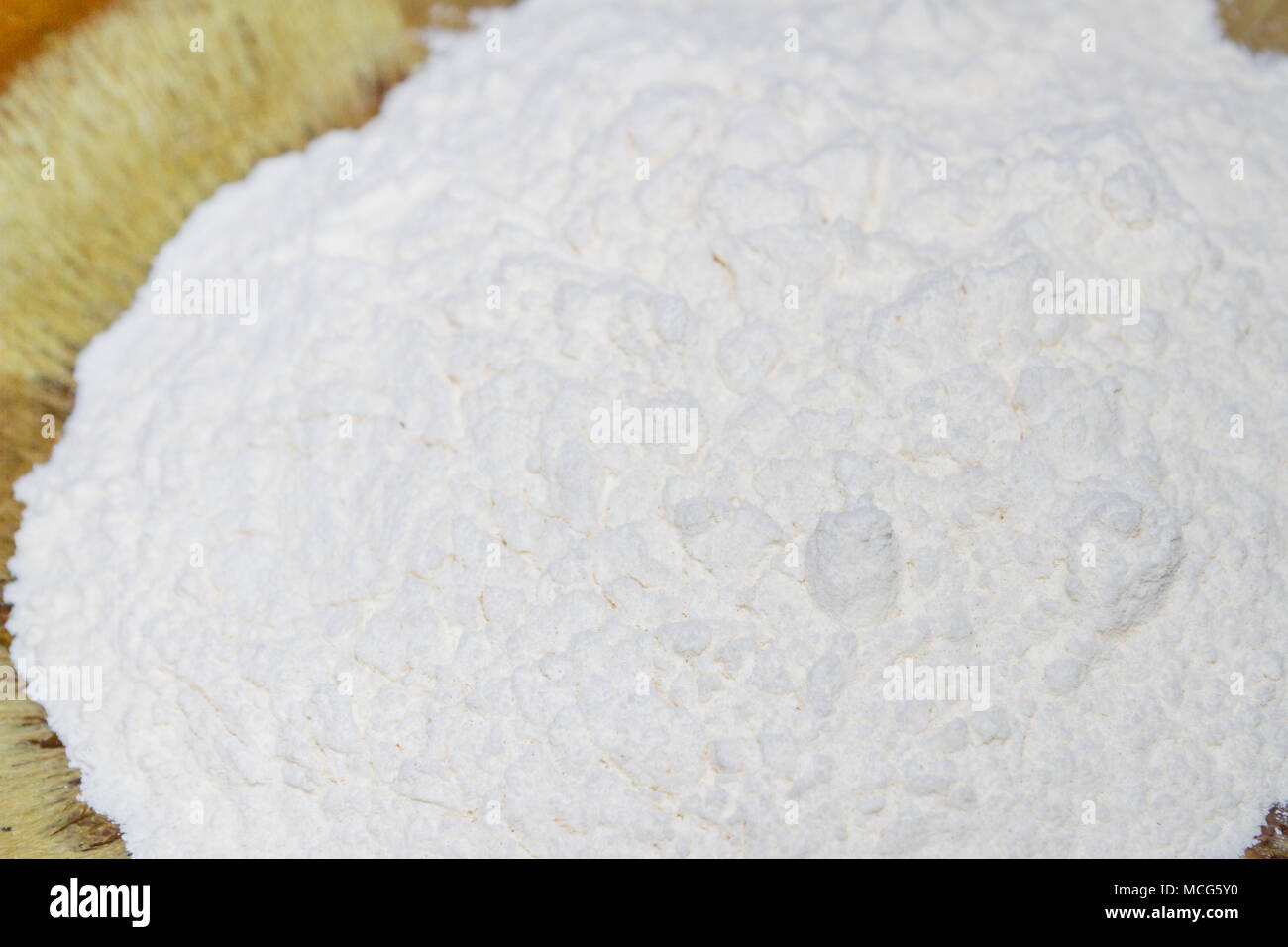 White crumbly flour poured on a plate with a slide Stock Photo - Alamy