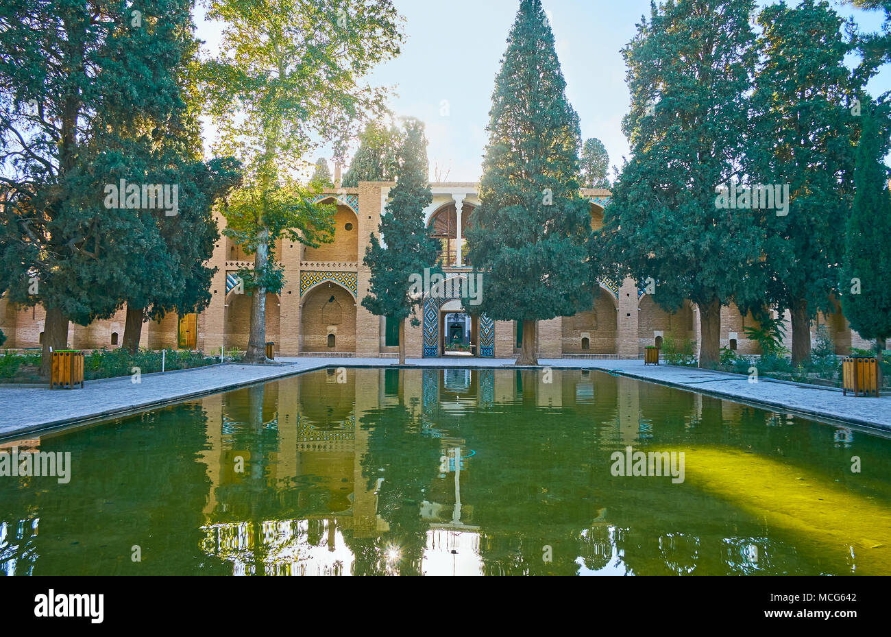 The scenic coniferous garden in Atabaki courtyard of Shah Nematollah ...