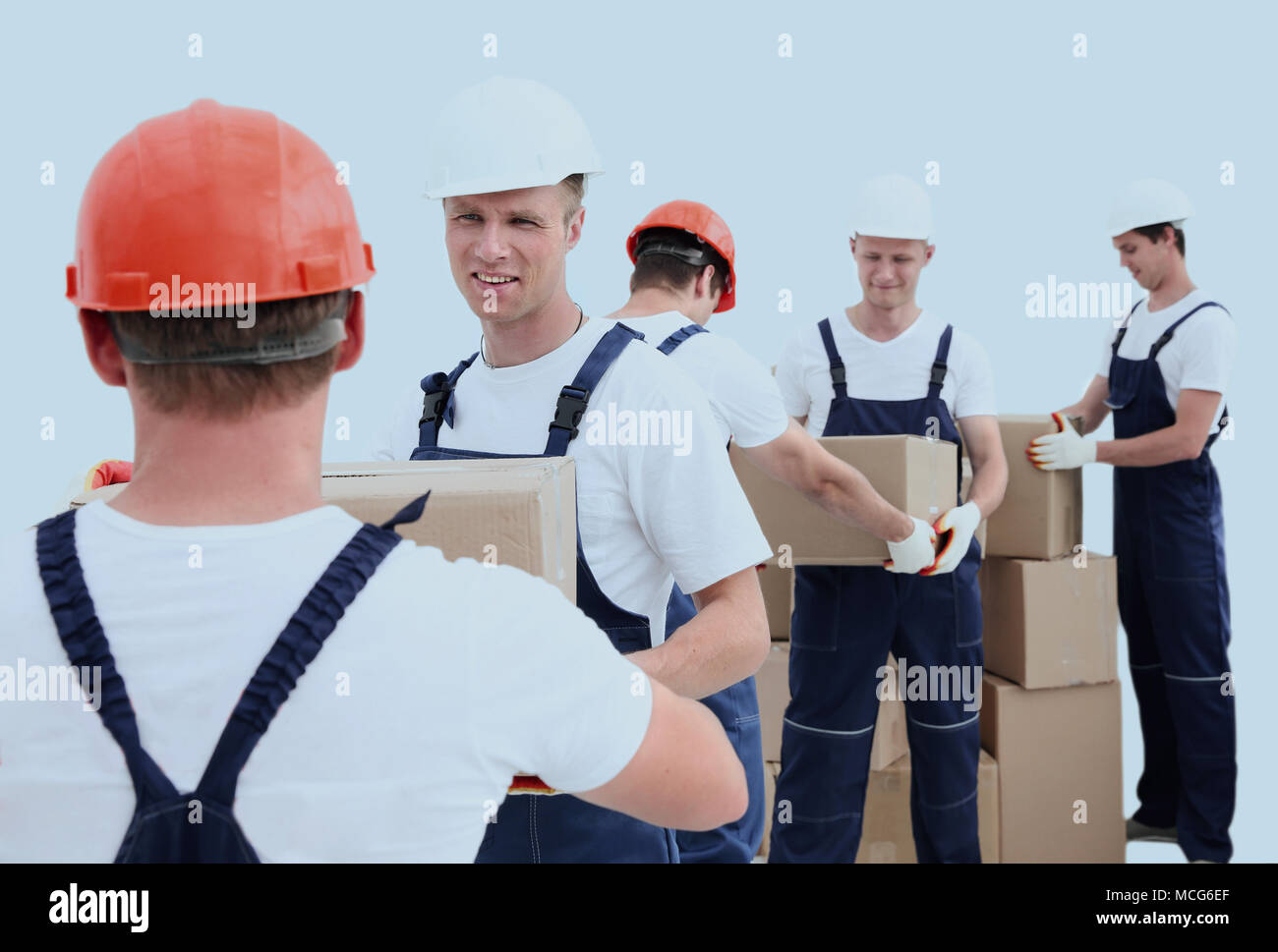 Group of people builders with boxes Stock Photo - Alamy