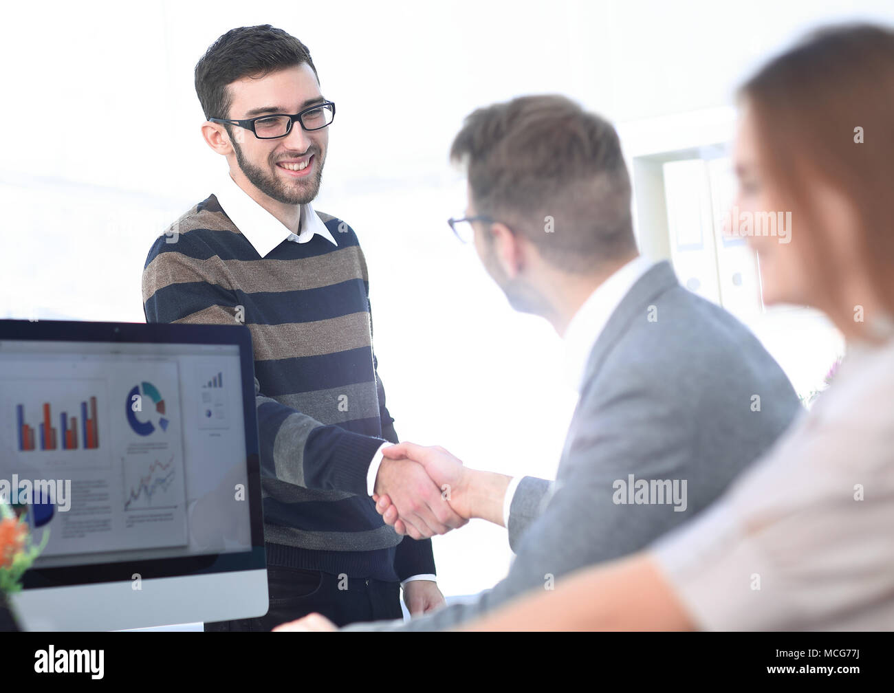 handshake Manager and the client Stock Photo - Alamy