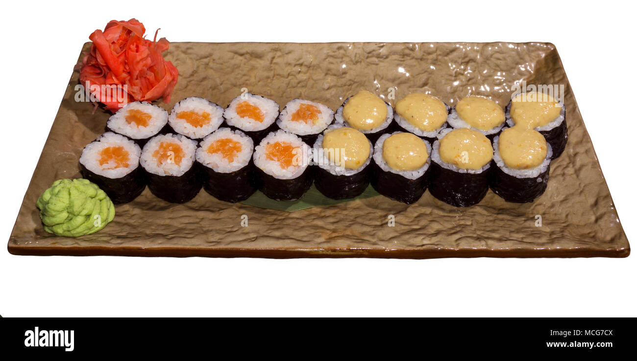 two kinds of traditional Japanese sushi rolls futomaki on a rectangular ...