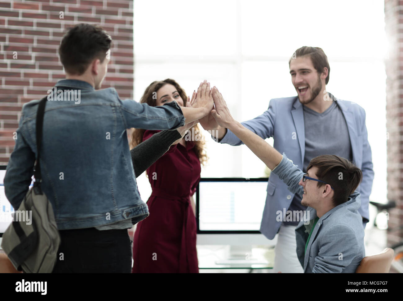 business team showing unity with their hands together Stock Photo - Alamy