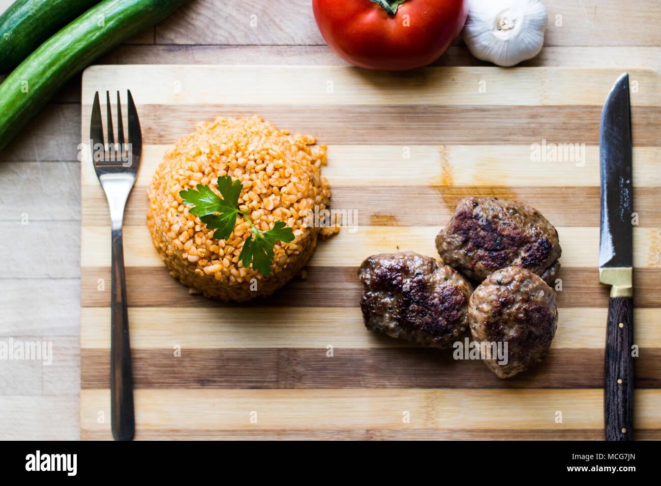 Turkish Meatball Kofte or Kofta with Pliav / Bulgur Pilaf, tomatoes and ...