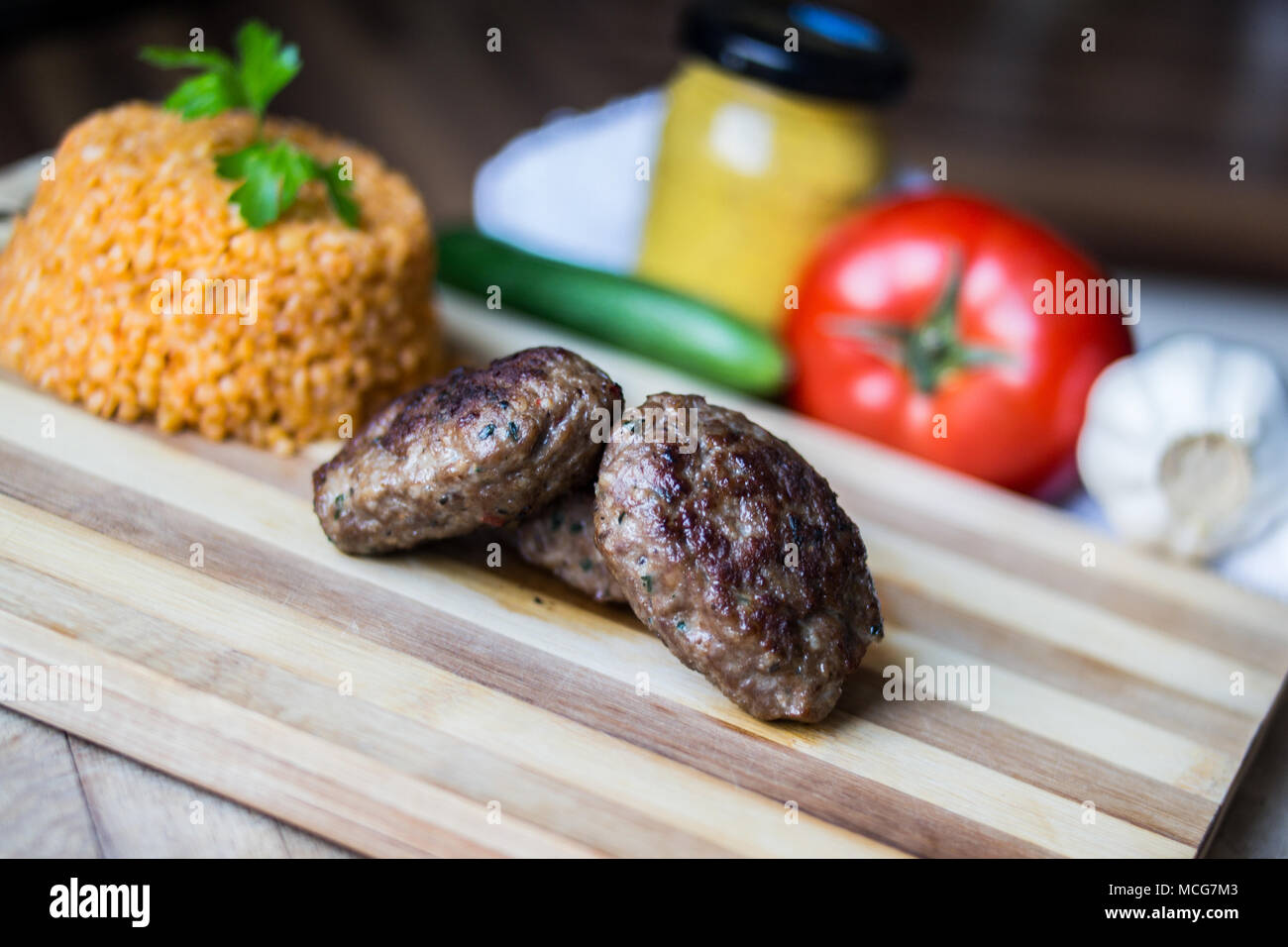 Turkish Meatball Kofte or Kofta with Pliav / Bulgur Pilaf, tomatoes and ...