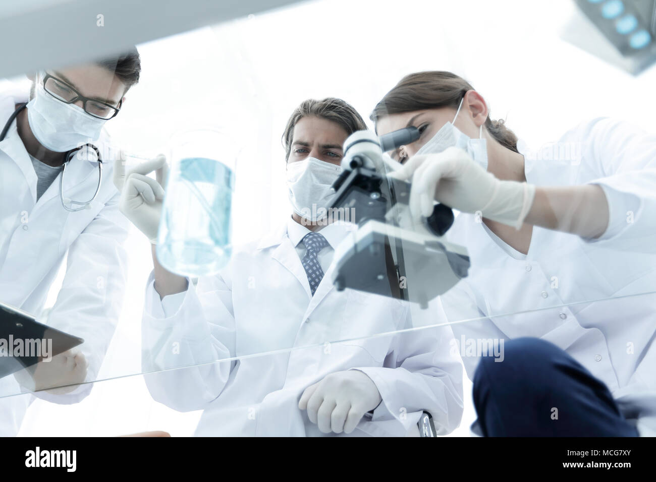 scientists conducting research in a lab environment Stock Photo - Alamy