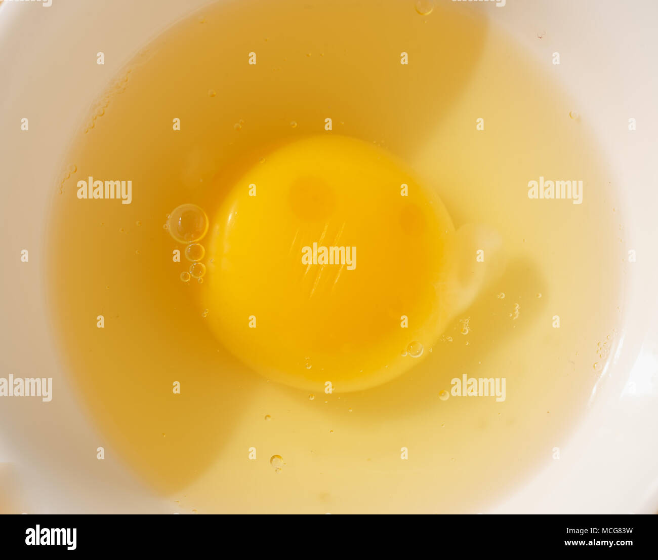 The close up of an open fresh egg Stock Photo - Alamy