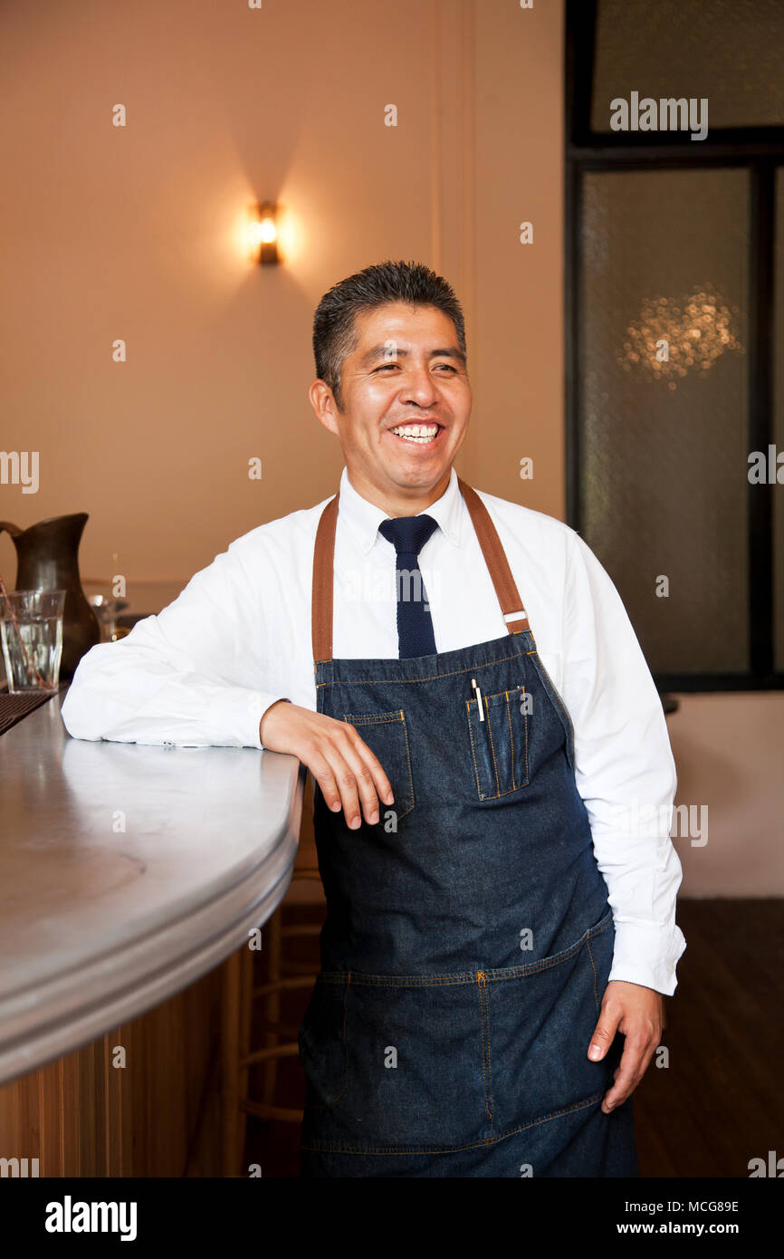 Portrait of server, Aureliano Rivera Barragan at the bar inside Havre ...