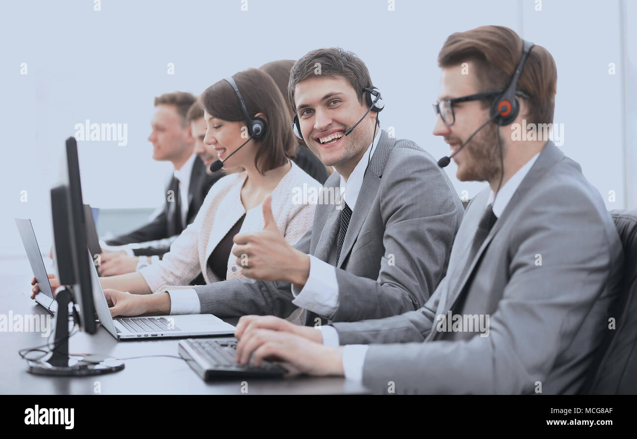 employee call center with headset showing thumb up Stock Photo - Alamy